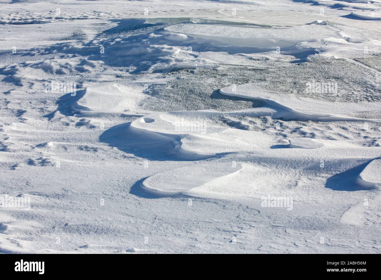 Snow drift patterns as background Stock Photo - Alamy