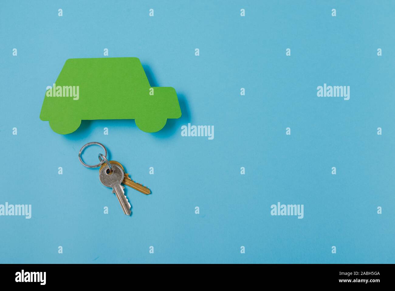 paper green cars figure with keys. top view on blue background Stock ...