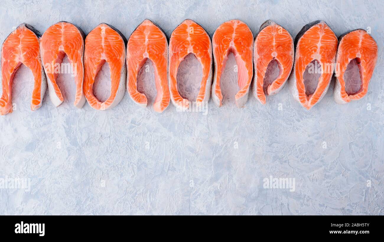 fresh uncooked red fish fillet over white Stock Photo - Alamy