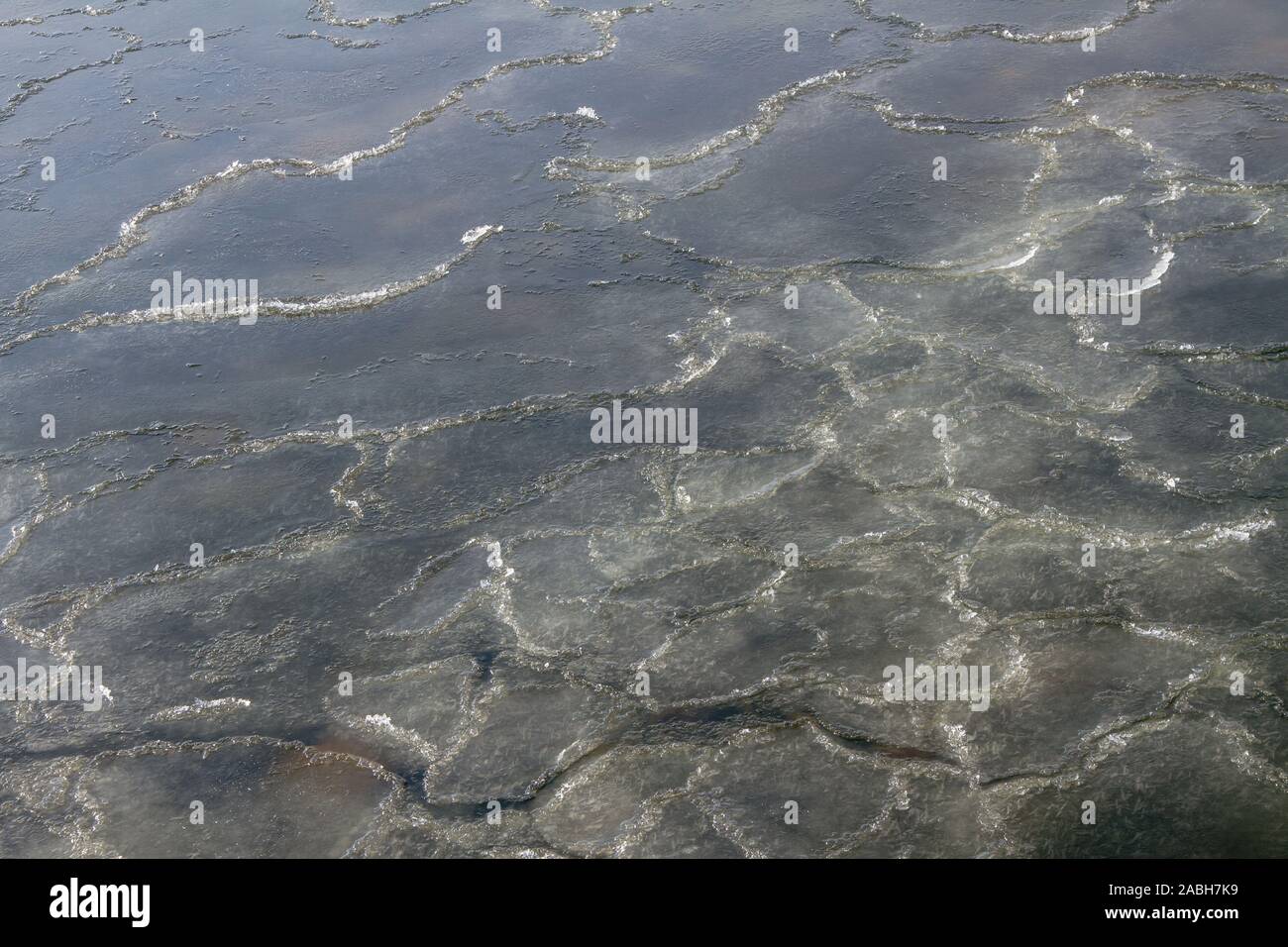 Beautiful and dangerous surface of snow sludge on water Stock Photo - Alamy