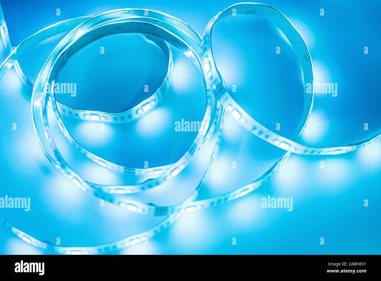 Bright neon LED strip glows blue. Copyspace Stock Photo - Alamy