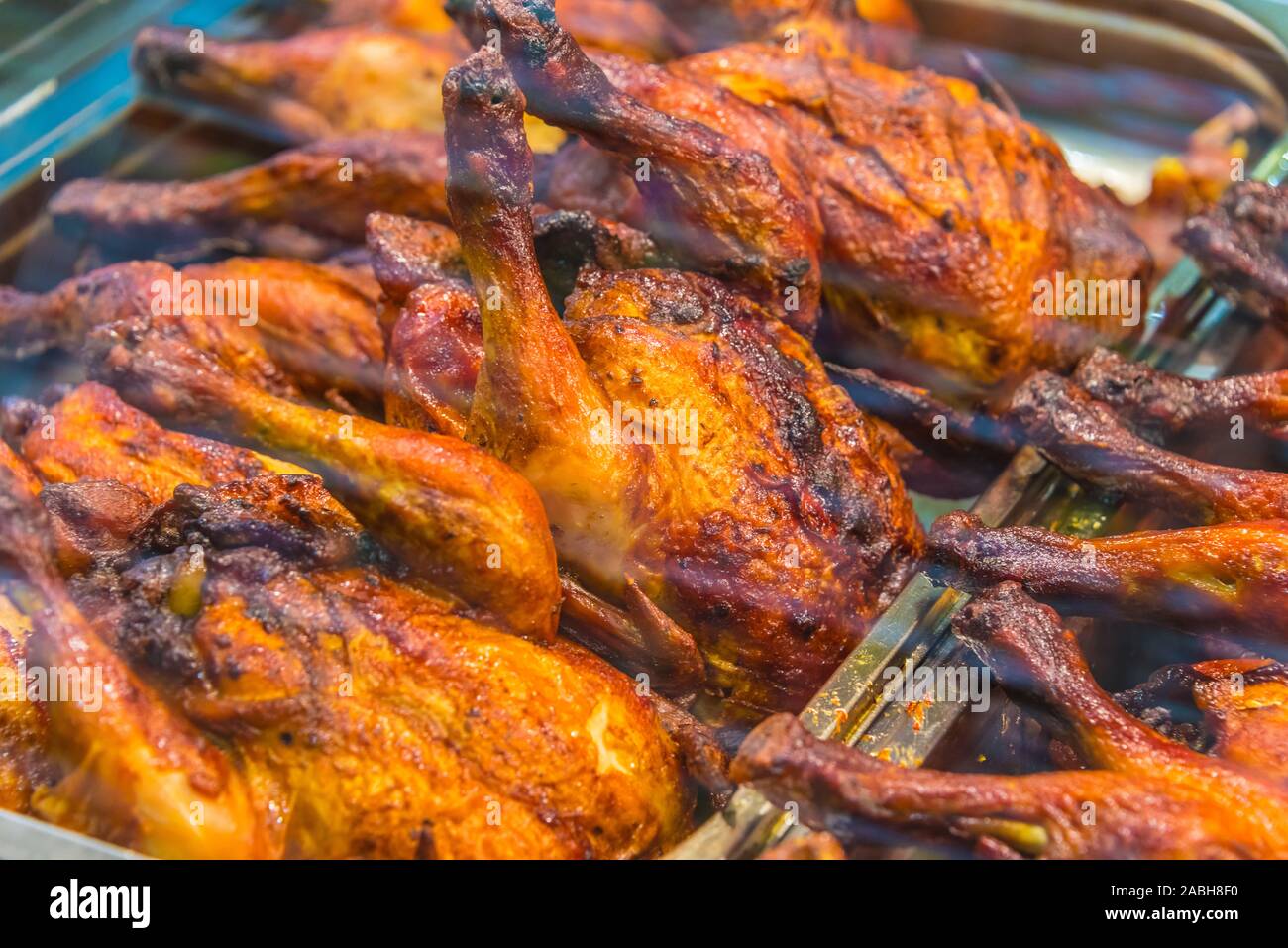 Roasted chicken on supermarket display. Ready to eat food Stock Photo ...