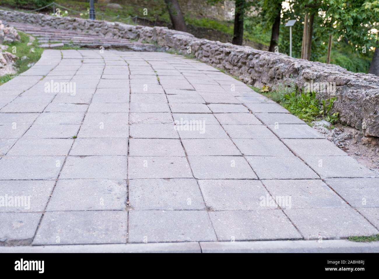 A path made of stone cobblestones with stone railings leading to the ...