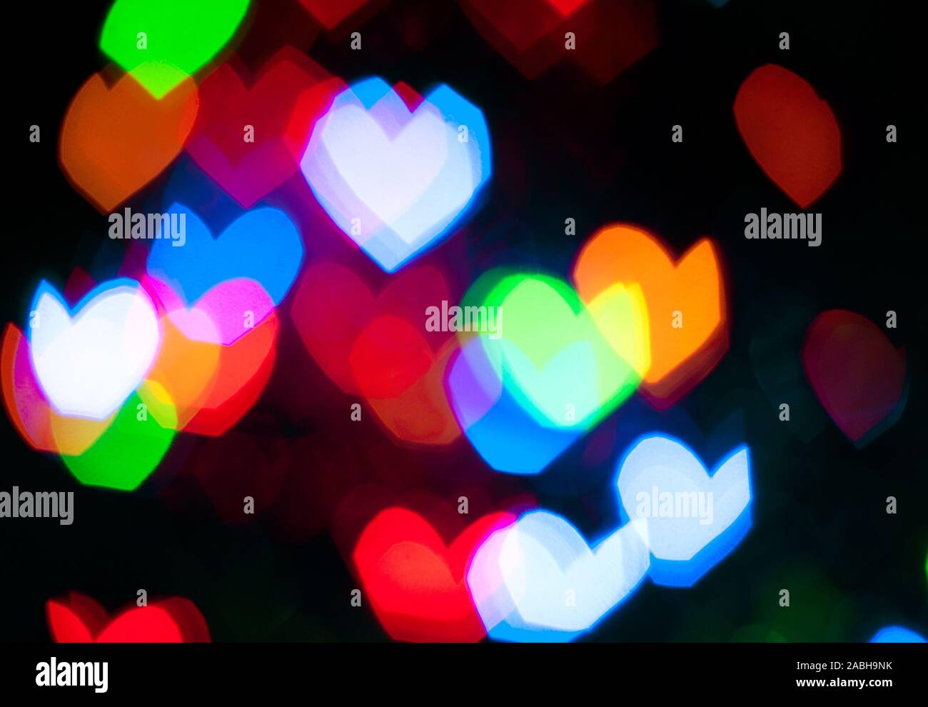 Glowing and festive colored light hearts created from in camera and ...