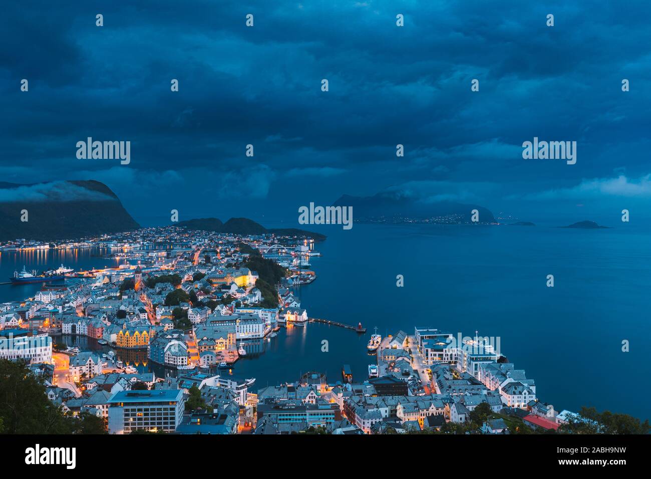 Alesund, Norway. Night View Of Alesund Skyline Cityscape. Historical ...