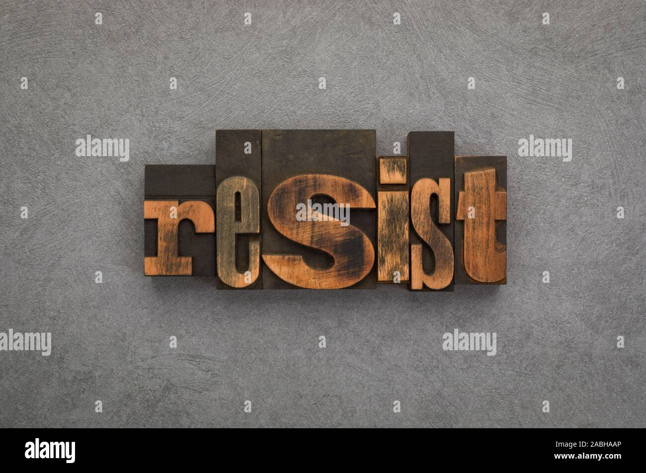 Resist, single word written with vintage letterpress printing blocks on ...