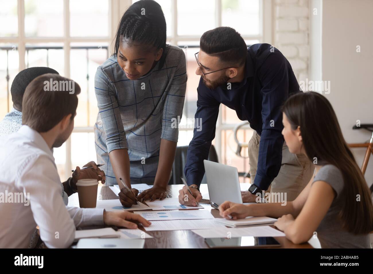Diverse group of managers working together at office Stock Photo - Alamy