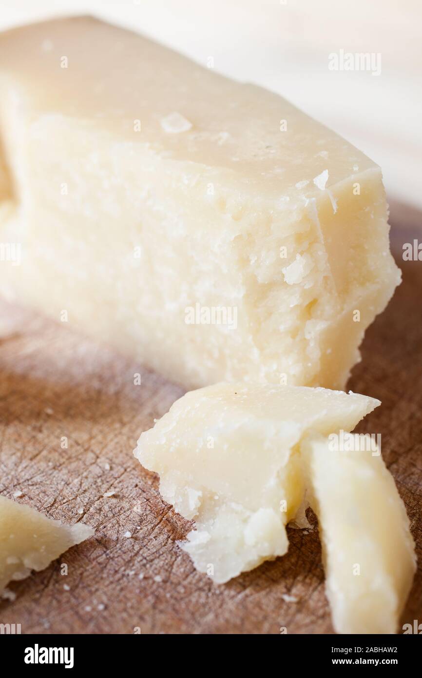 Italian original Parmesan Cheese slice Stock Photo - Alamy
