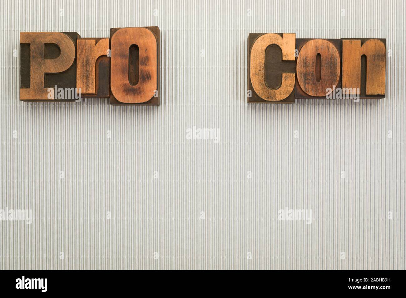 Pro and Con, words written with vintage letterpress type on textured ...