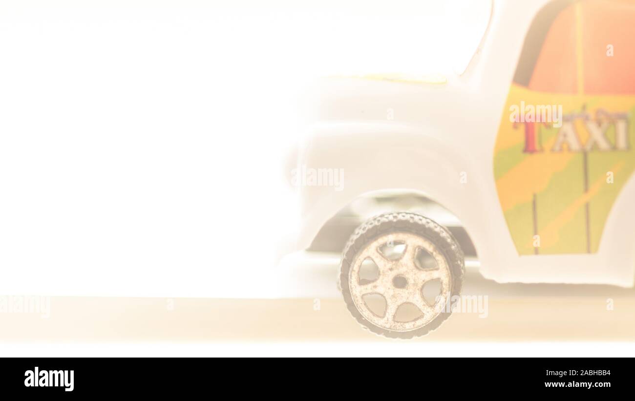 white car toy taxi in bright light road Stock Photo - Alamy
