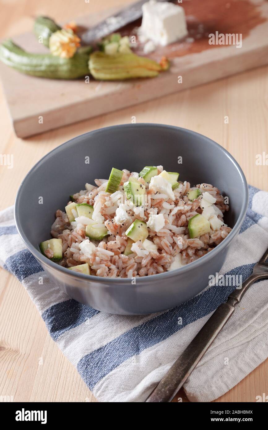 Spelt, basmati rice, raw courgette and feta cheese healthy meal Stock ...