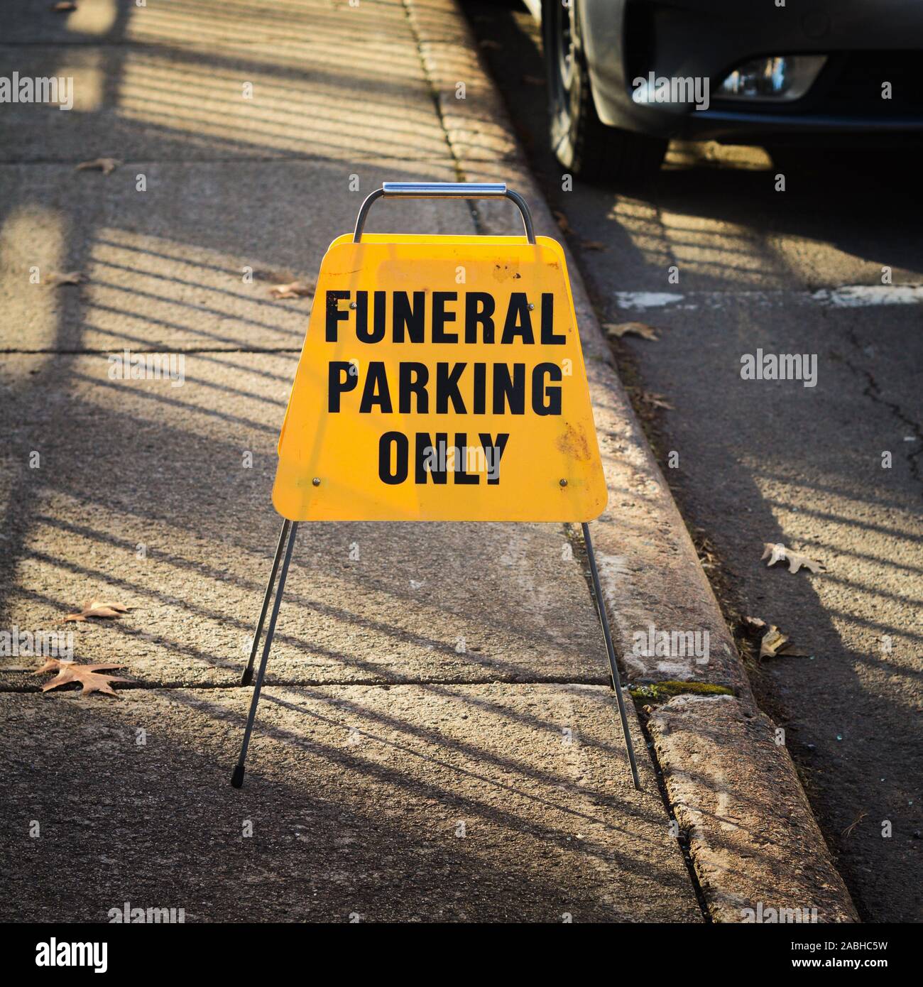 Funeral parking only sign on sidewalk Stock Photo - Alamy