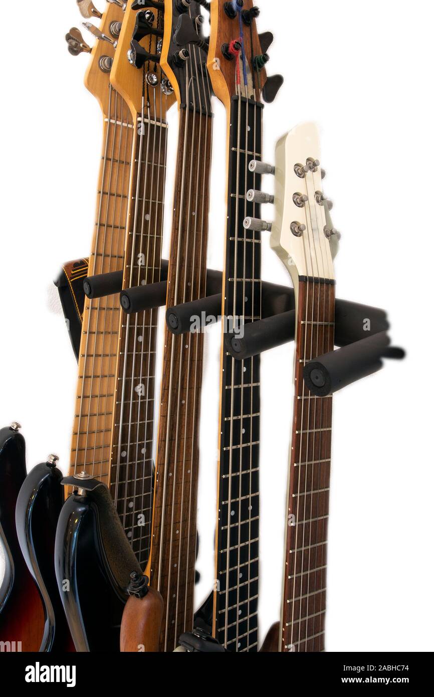 Various electric guitars in a row isolated on white background Stock ...