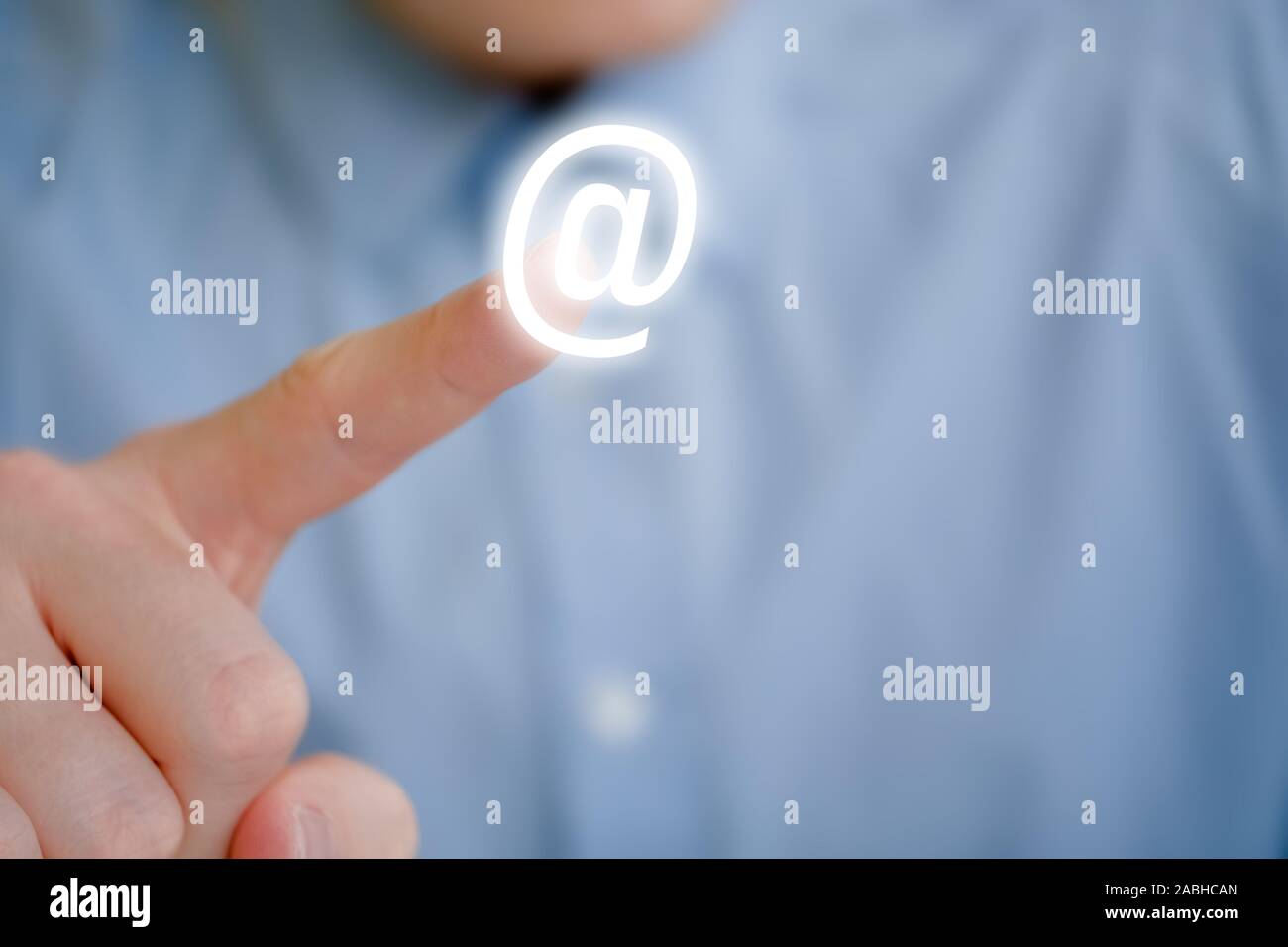 A male finger points to an email icon. The concept of the appeal to ...