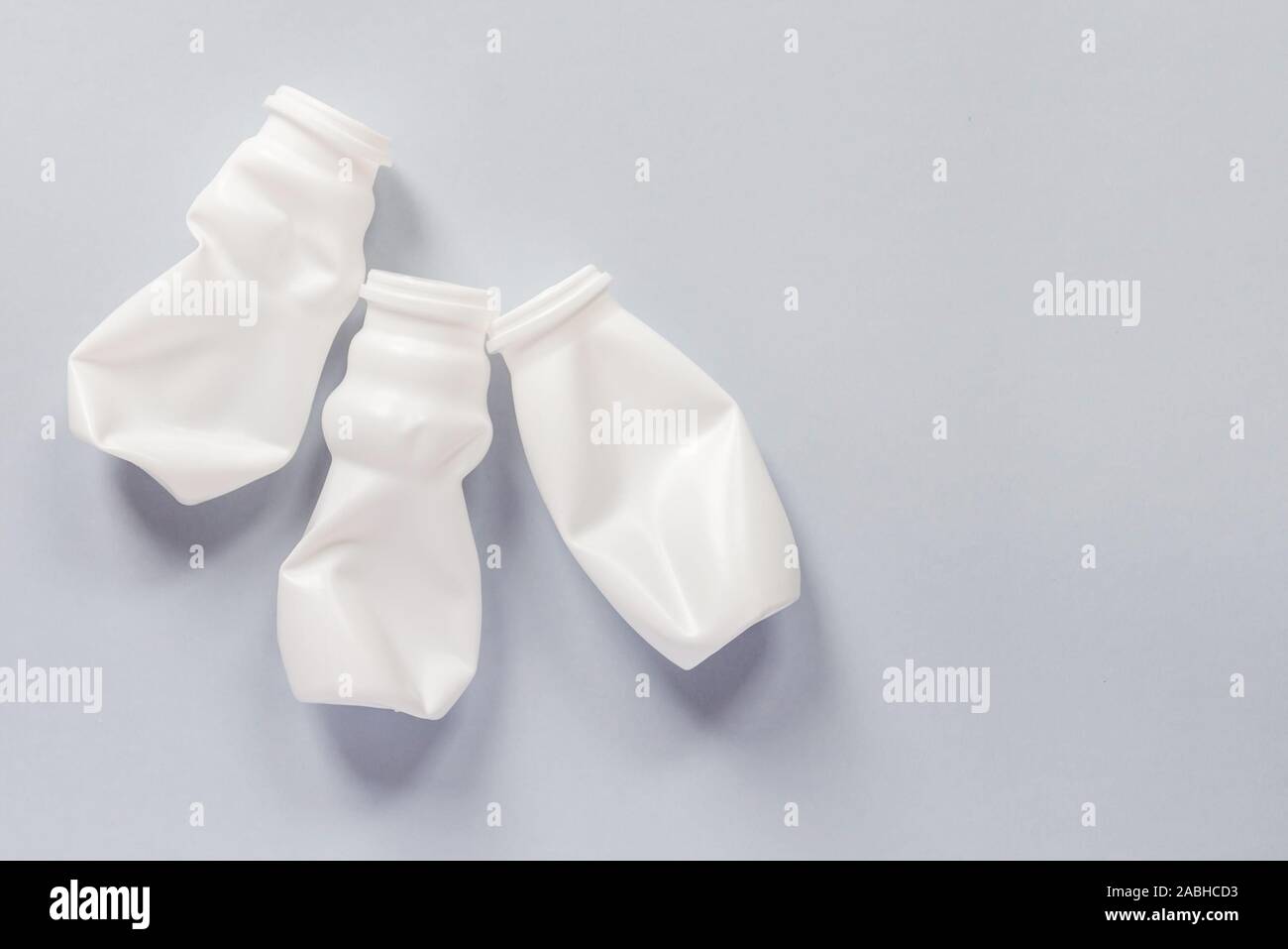 Used white plastic packaging for food on a gray background Stock Photo ...
