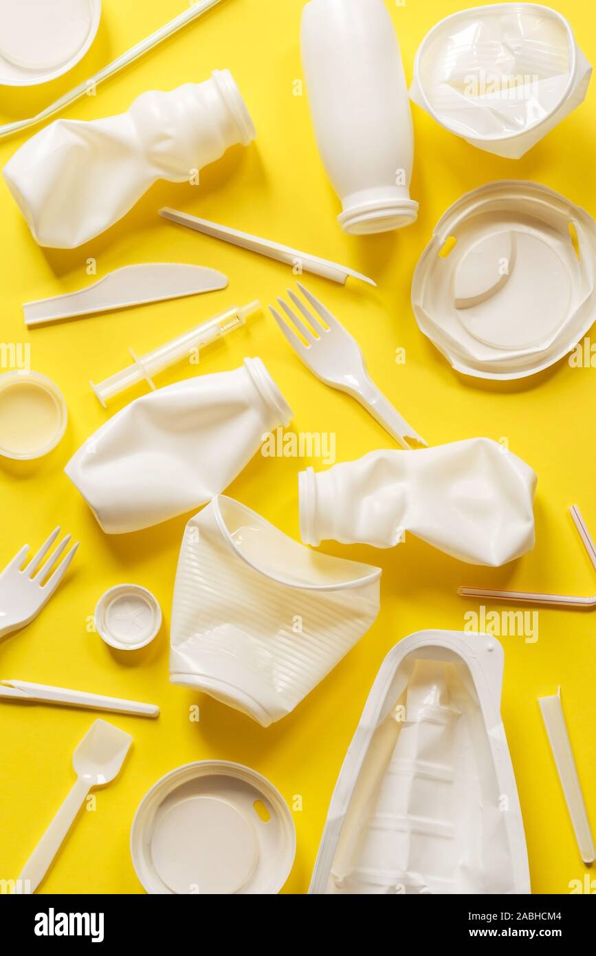 Used white plastic packaging for food on a yellow background Stock ...