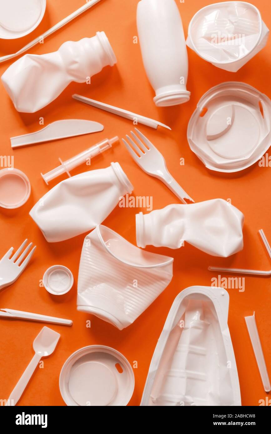 Used white plastic packaging for food on a red background Stock Photo ...
