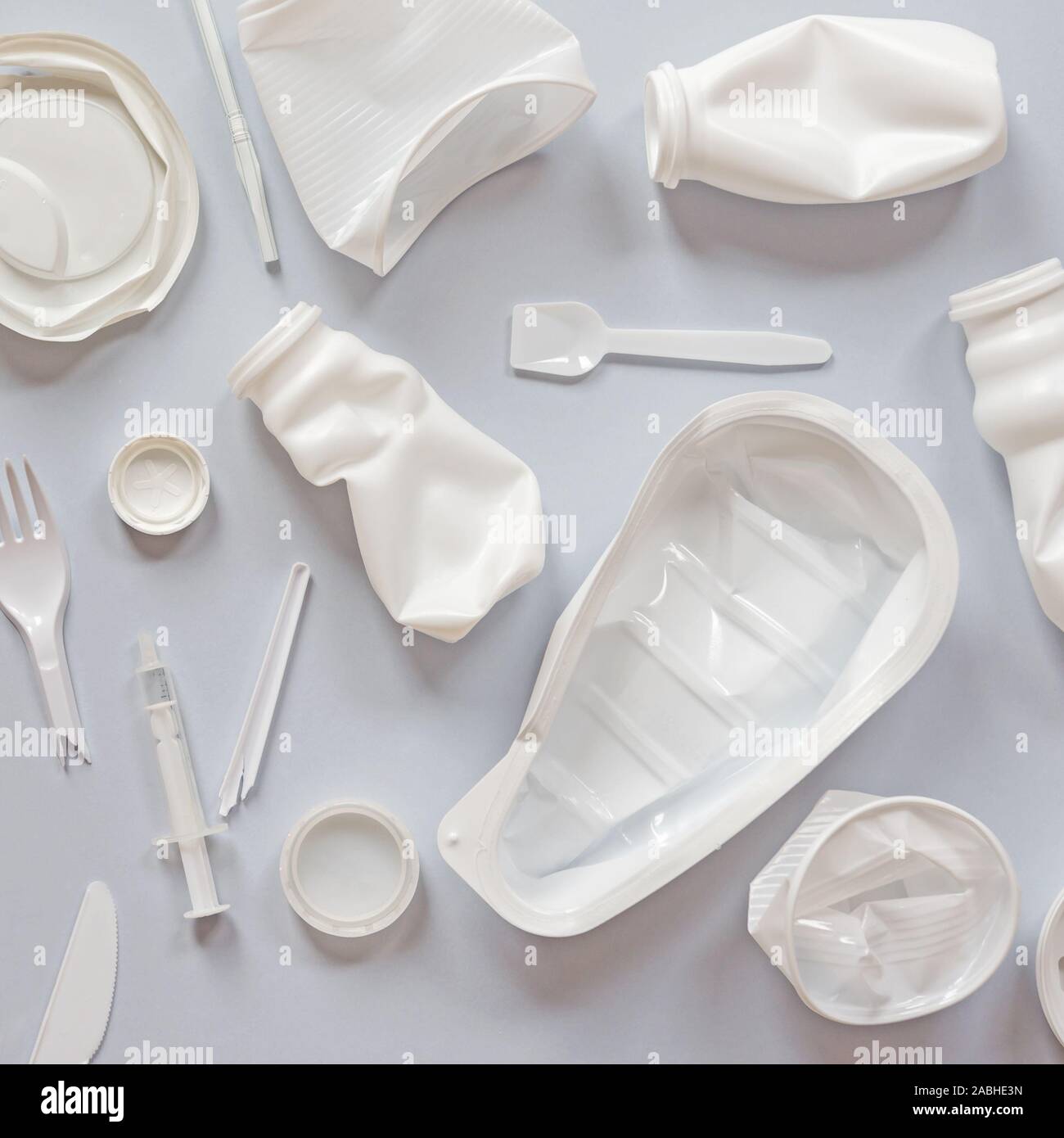 Used white plastic packaging for food on a gray background Stock Photo ...