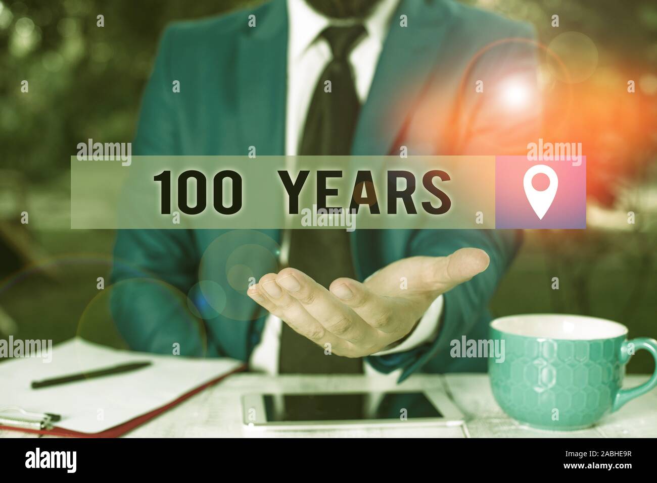 Writing note showing 100 Years. Business concept for Remembering ...