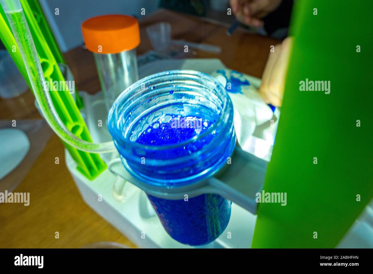 Test tube with blue bubbling liquid in the laboratory Stock Photo - Alamy