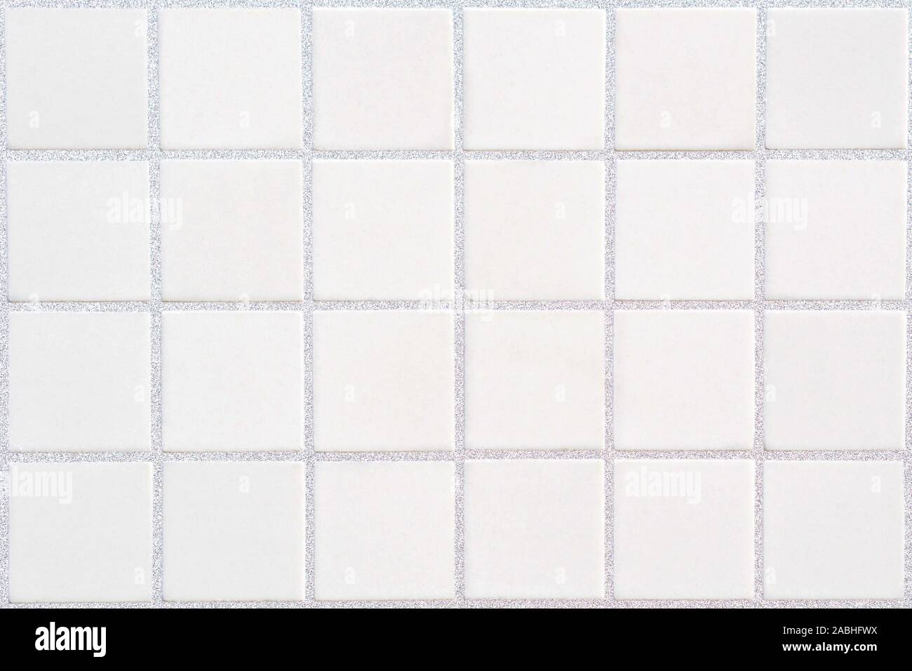 white ceramic tile with 24 squares in rectangular form with silver ...