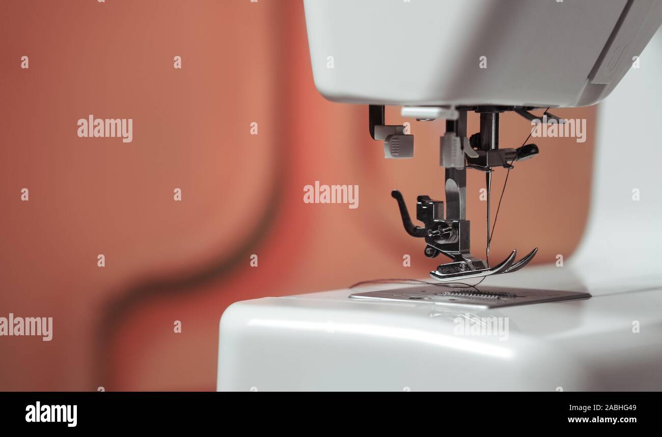 Close up on Sewing machine needle mechanism in red tailor shop Stock ...