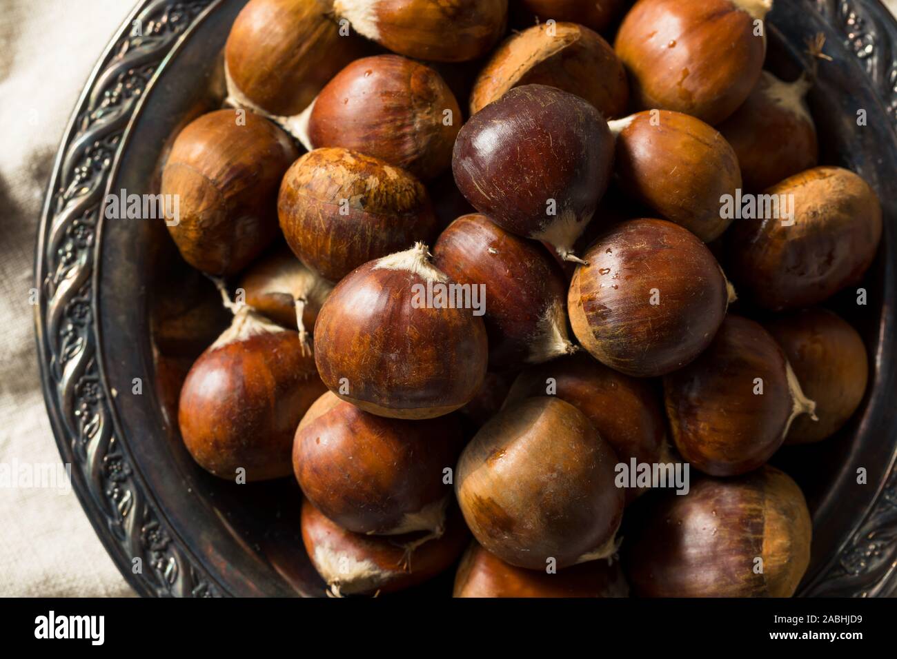 Raw Organic Brown Chestnuts Ready to Roast Stock Photo - Alamy