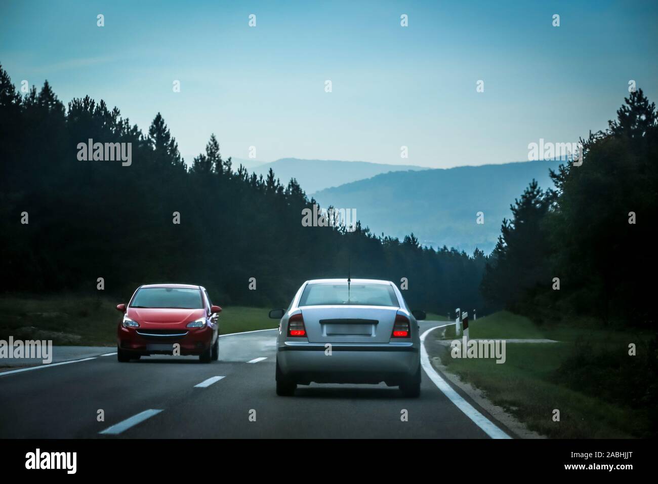 Cars driving on the two way road with landscape of Gorski Kotar in ...