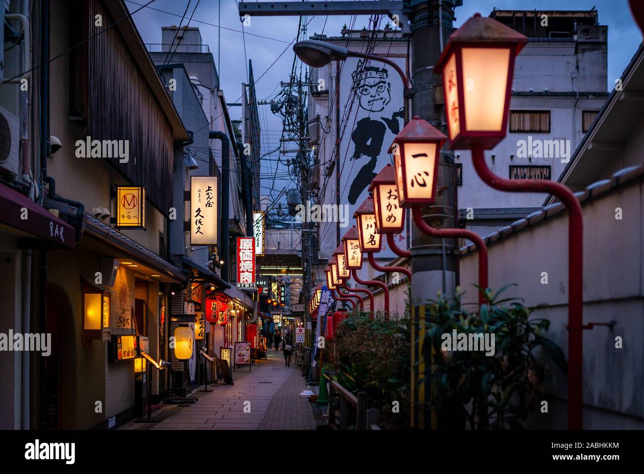 Osaka, Japan - March 21, 2017: Street light posts and restaurant ...
