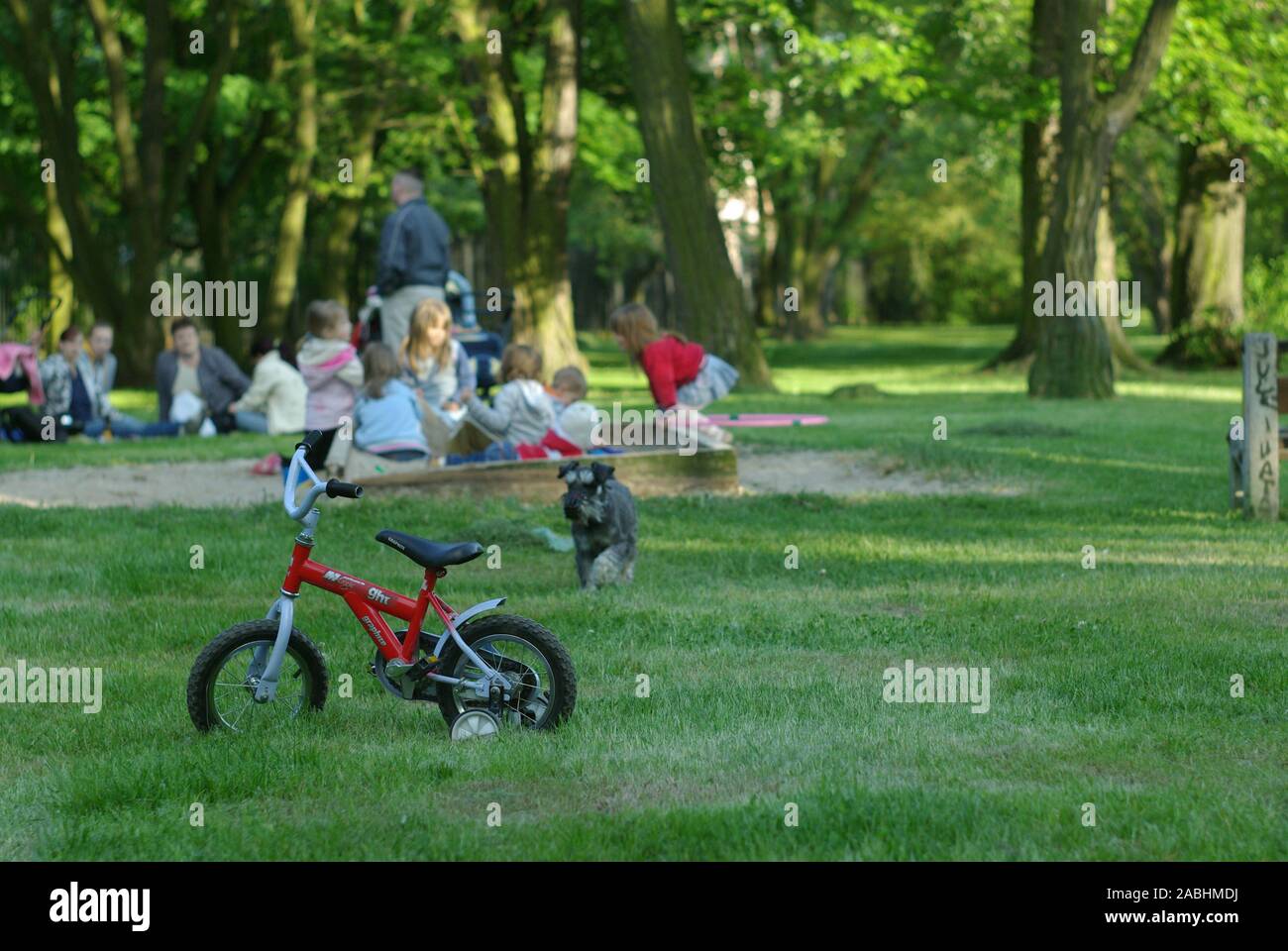 Lawn bicycle playground hi-res stock photography and images - Alamy