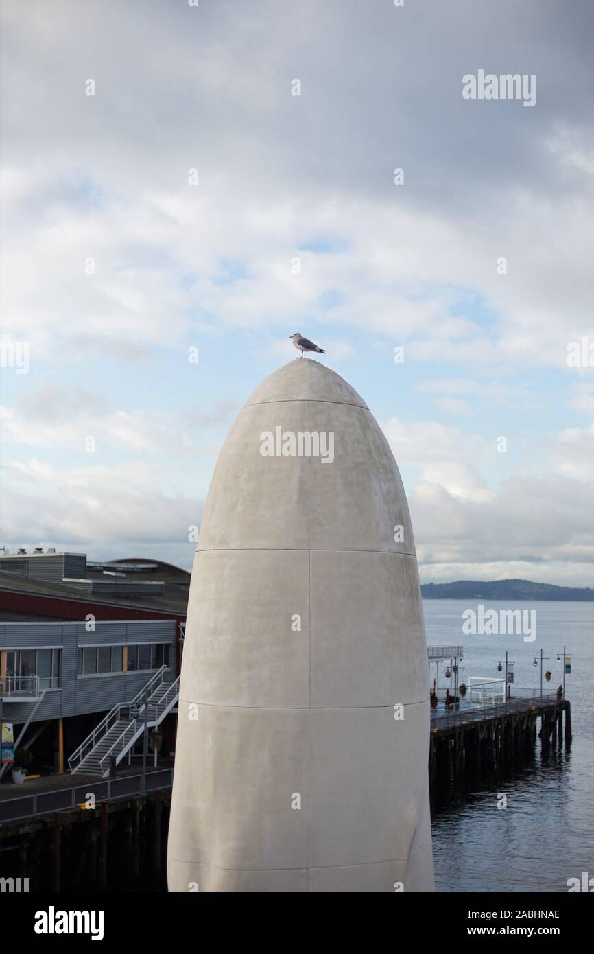A seagull sitting atop the sculpture "Echo" by James Plensa, at Olympic ...