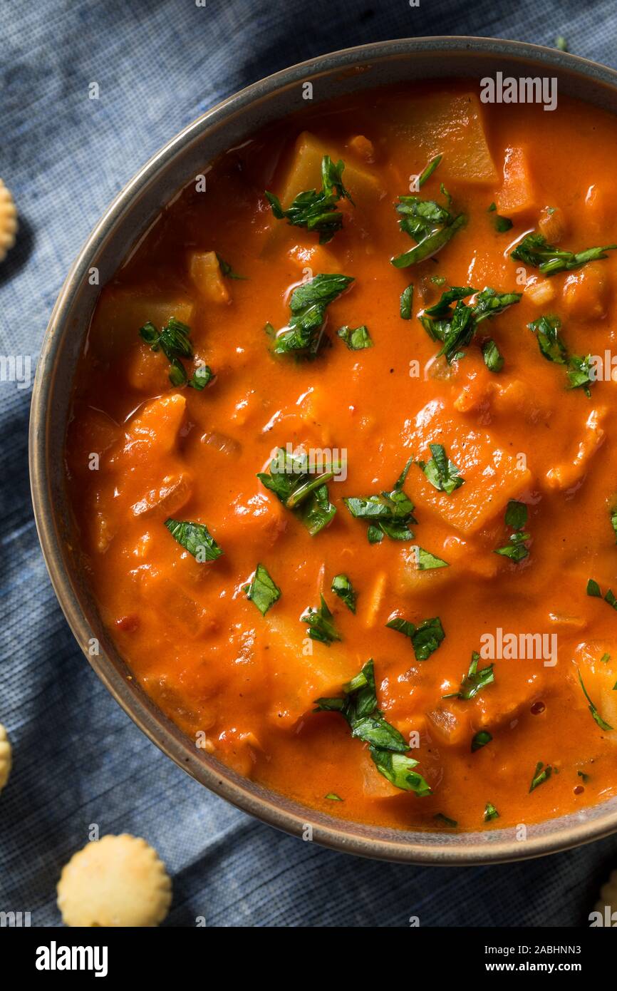 Homemade Red Tomato Manhattan Clam Chowder with Parsley Stock Photo - Alamy