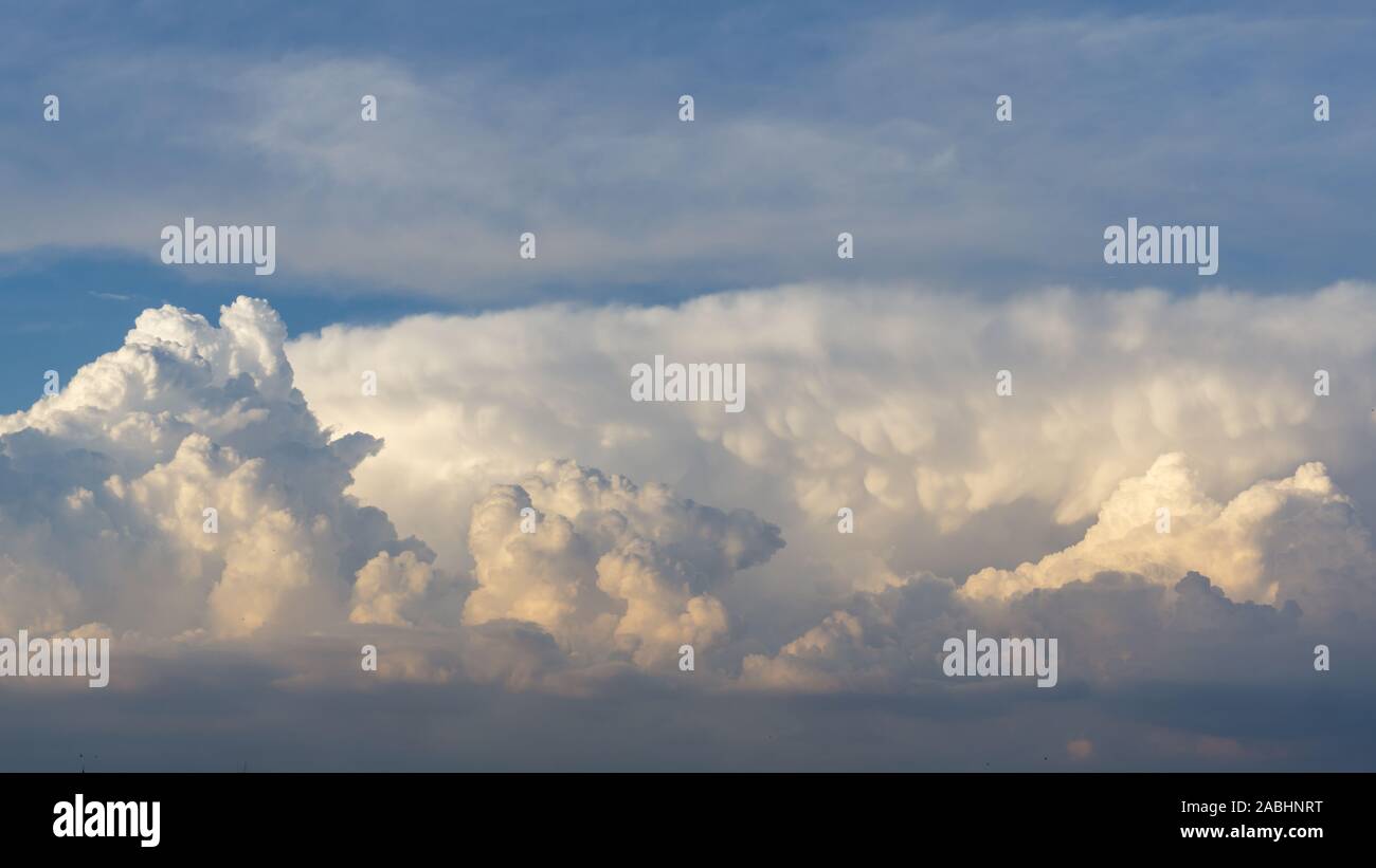 dense cloud clusters in blue sky Stock Photo - Alamy