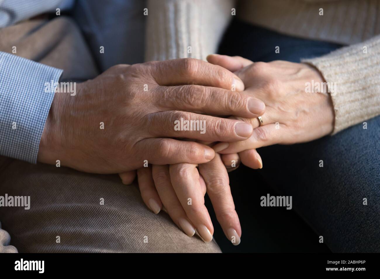 Close up image of elderly couple holding hands Stock Photo - Alamy