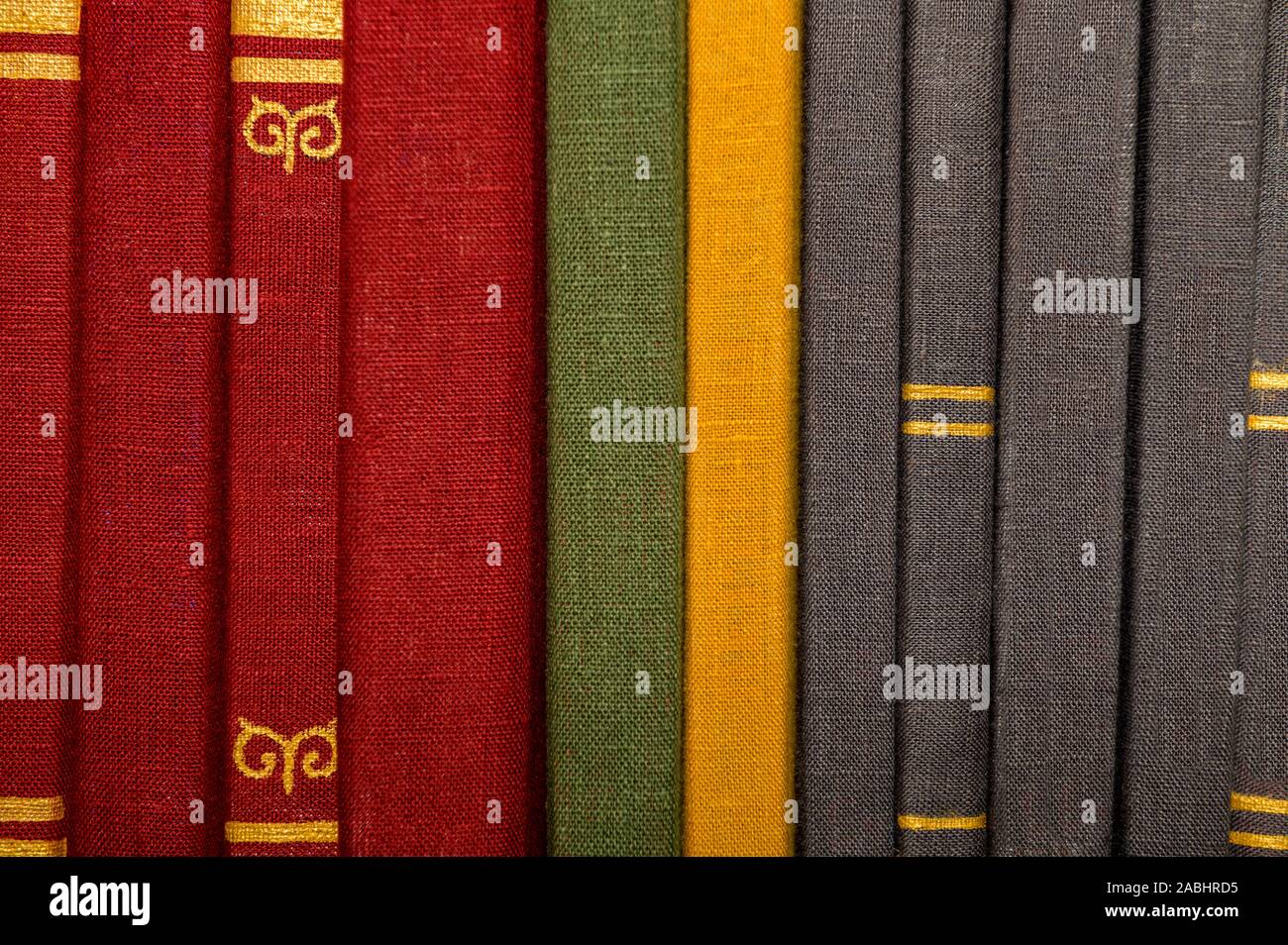 books of different colors on a bookshelf Stock Photo - Alamy