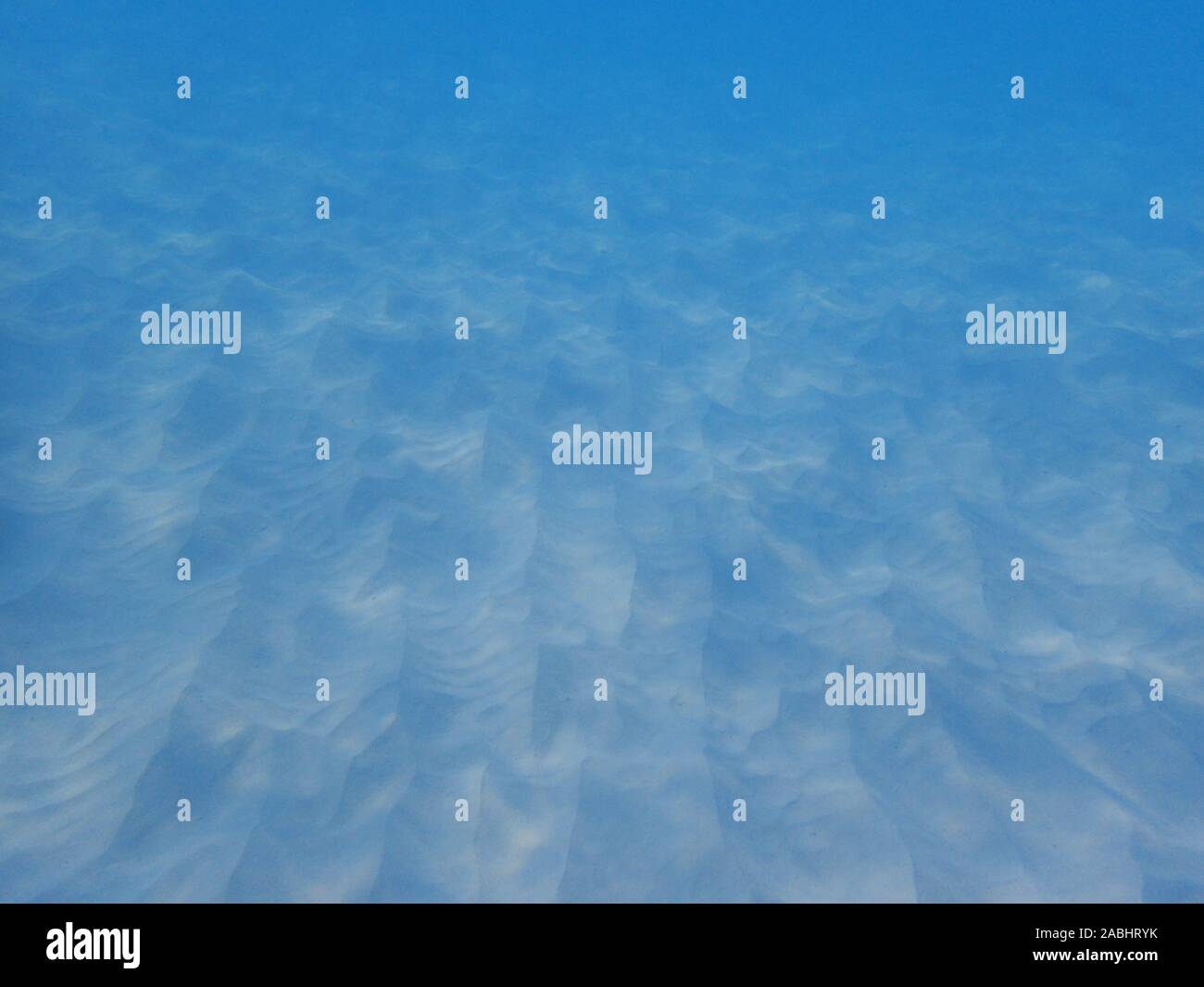 Sand underwater that the waves have formed a pattern that is unique ...