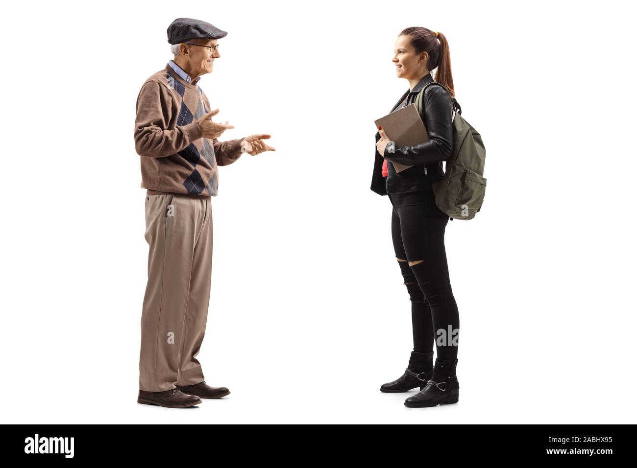 Full length profile shot of a senior man talking to a female student ...