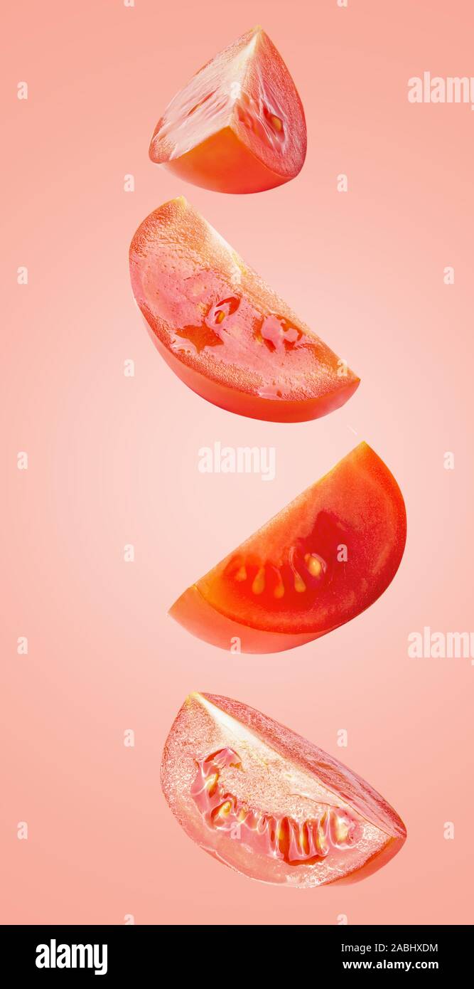 Floating tomatoes isolated on light coral background Stock Photo - Alamy