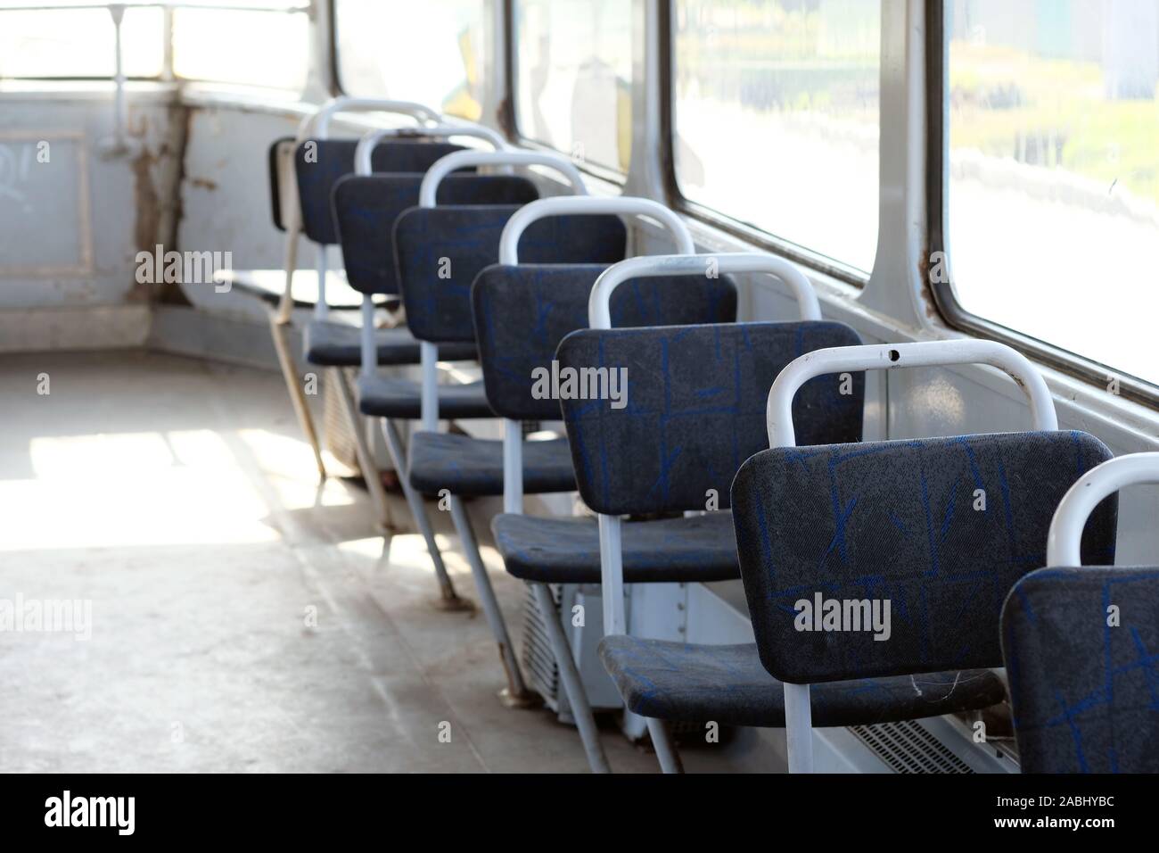 Seats in the old tram. Empty lounge of an old city transport. Public ...