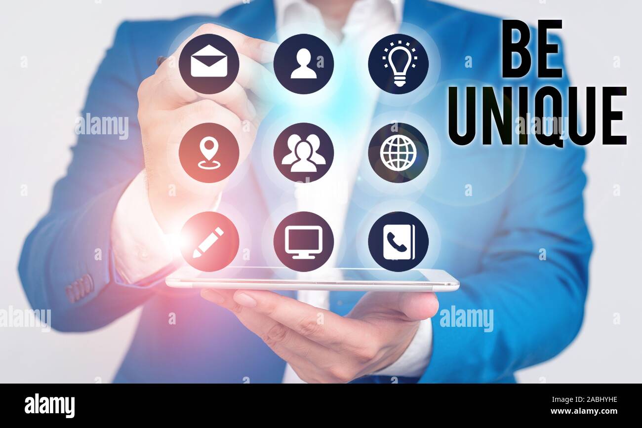 Writing note showing Be Unique. Business concept for being the only one ...