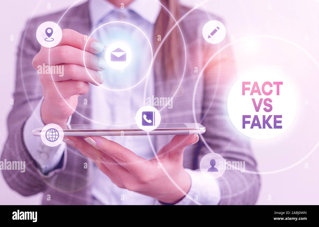 Writing note showing Fact Vs Fake. Business concept for Rivalry or ...