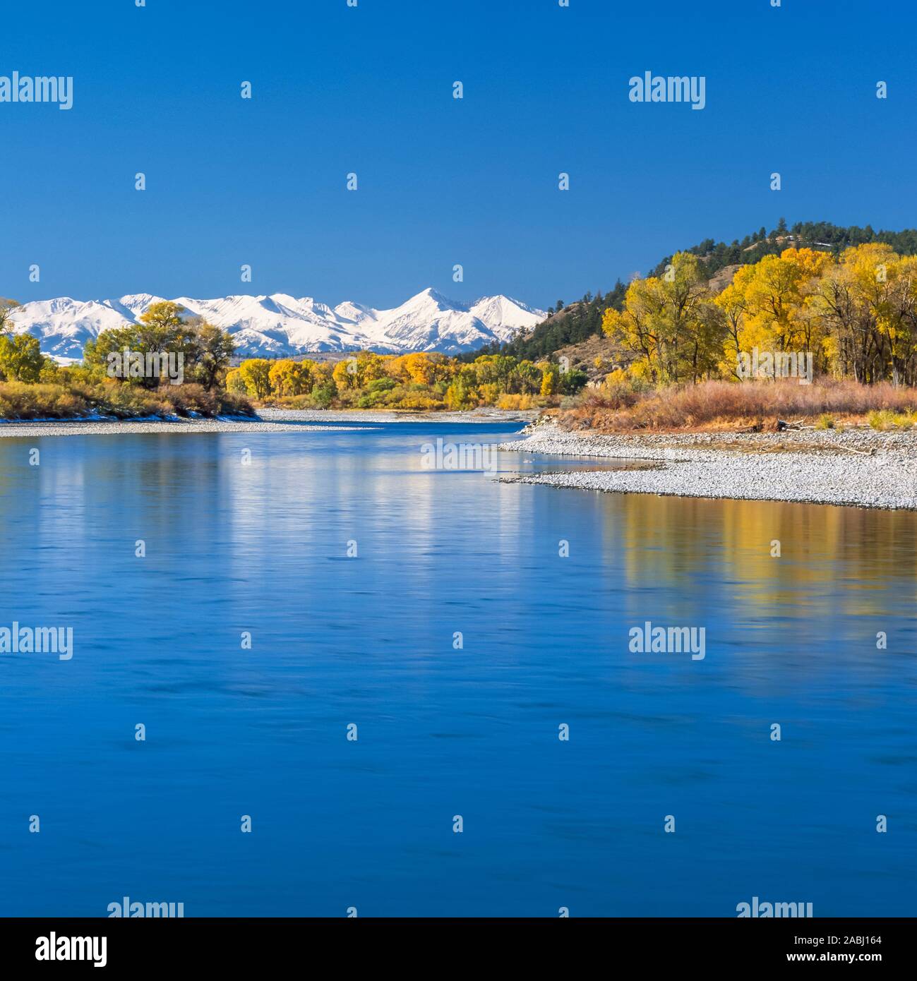 fall colors along the yellowstone river below the crazy mountains near ...