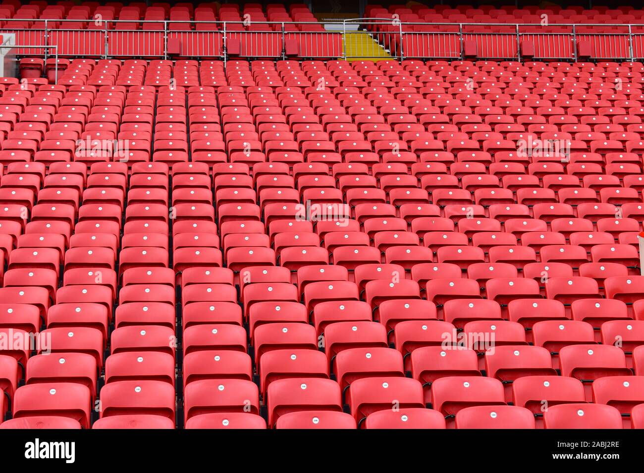 Red plastic seats in a stadium. Place for Liverpool football club ...
