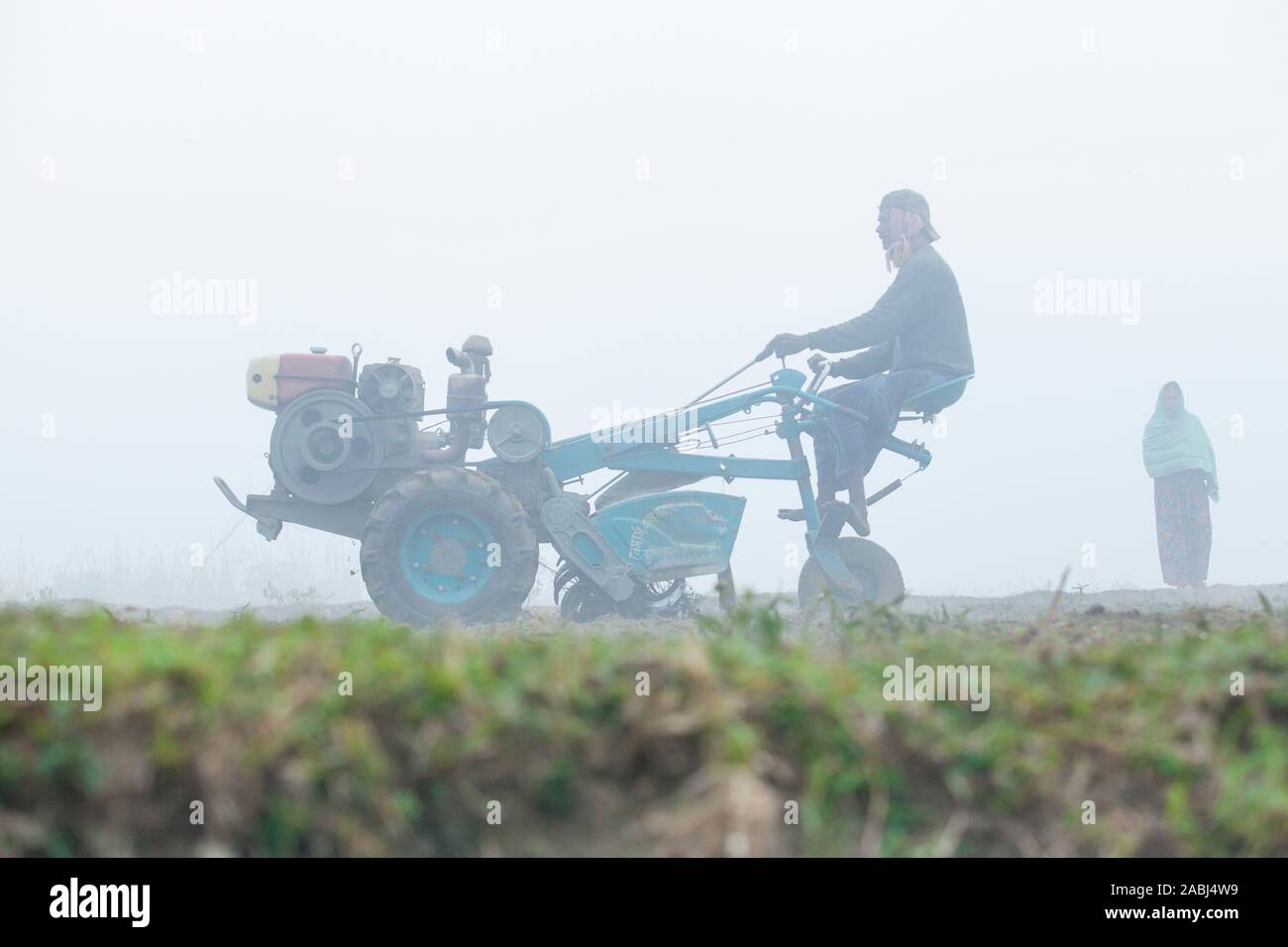 2 people riding on a tractor hi-res stock photography and images - Alamy