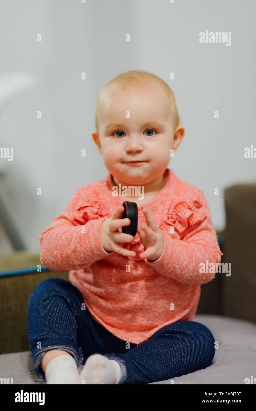 Portrait of adorable baby girl. Childhood. Authentic image Stock Photo ...