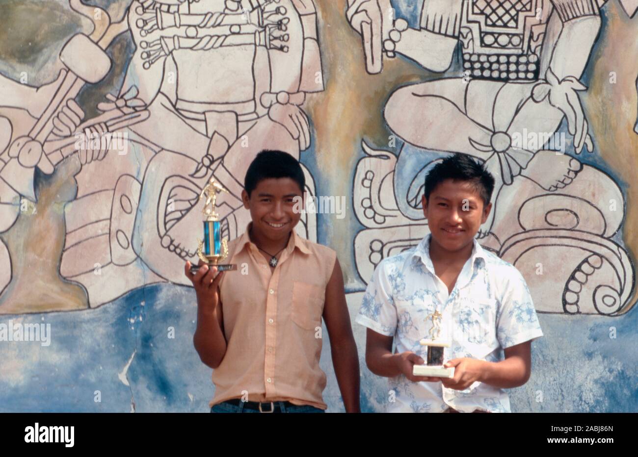 Two young, indigenous Chorti Maya boys show off their trophies at their ...