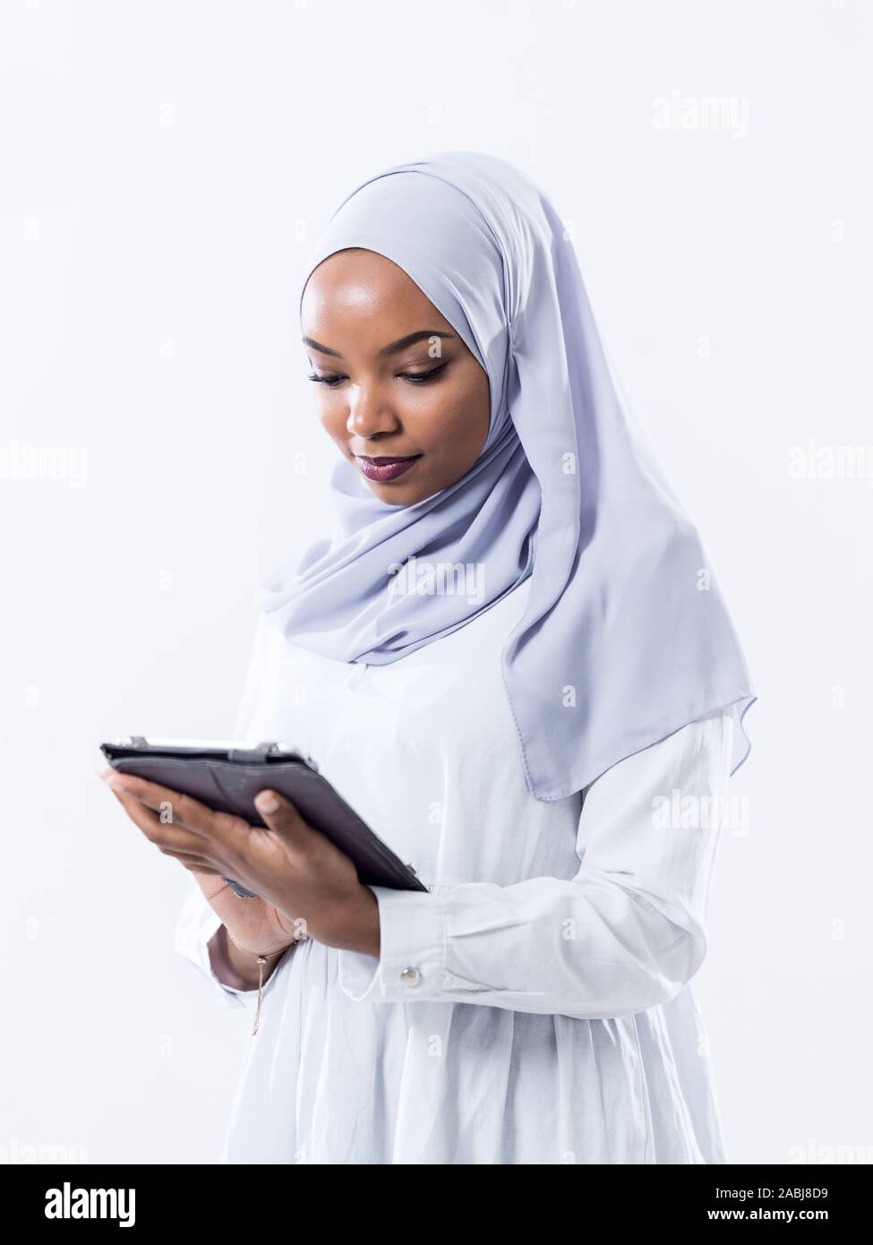 young modern muslim african business woman using tablet computer ...