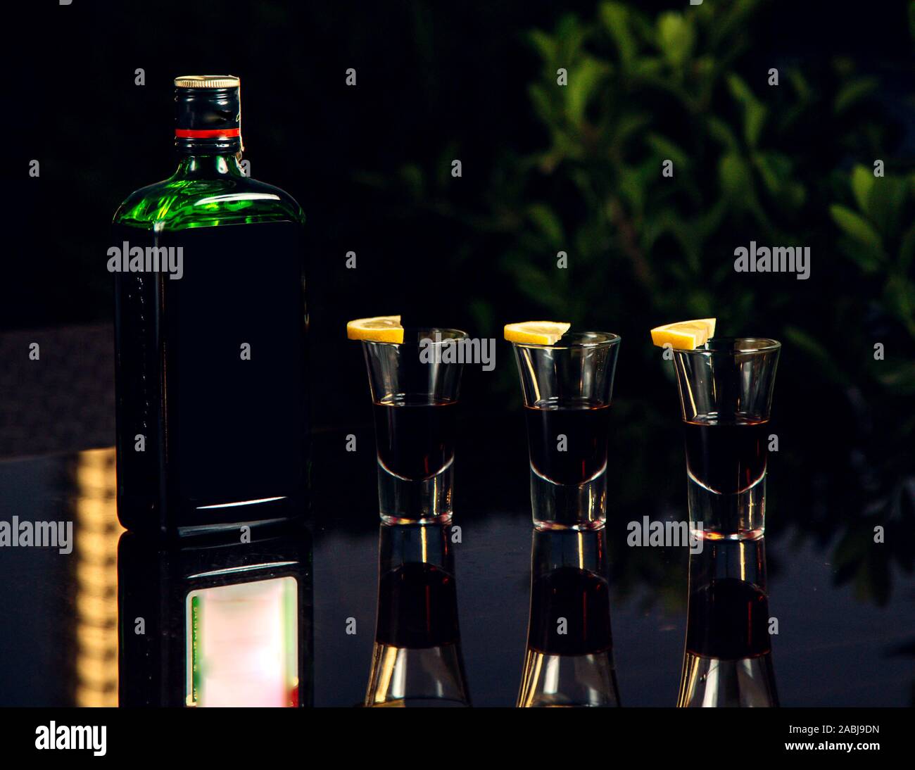 black beverage shots on the table Stock Photo - Alamy