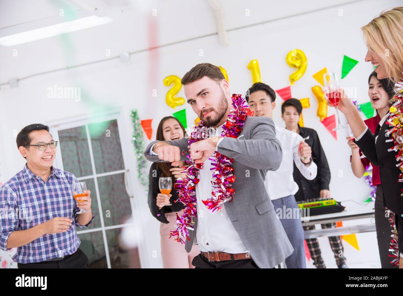 Dancing man of team leader drunk with staff. Business man fun joy party ...