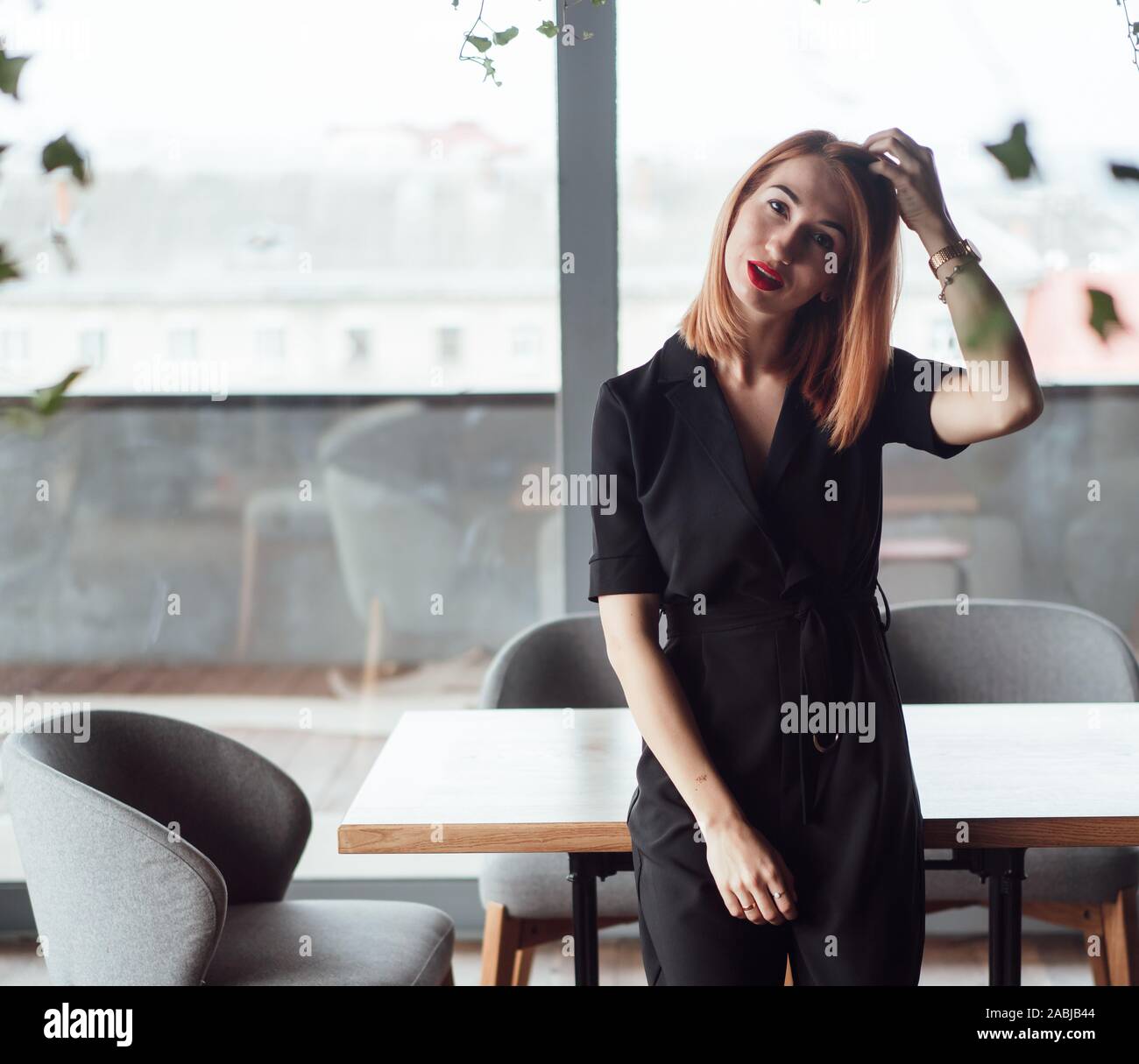 Beautiful woman posing on camera against the background of a large ...